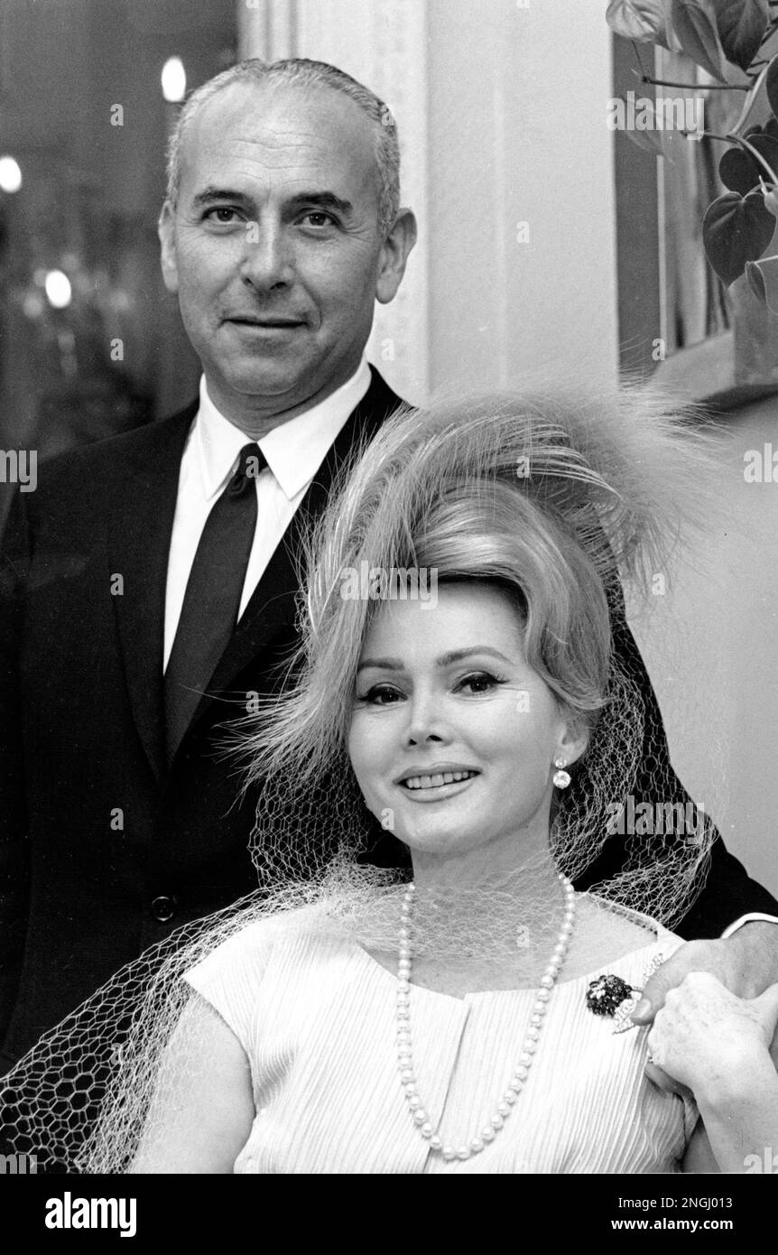 Actress Zsa Zsa Gabor and businessman Herbert Hutner pose together at ...