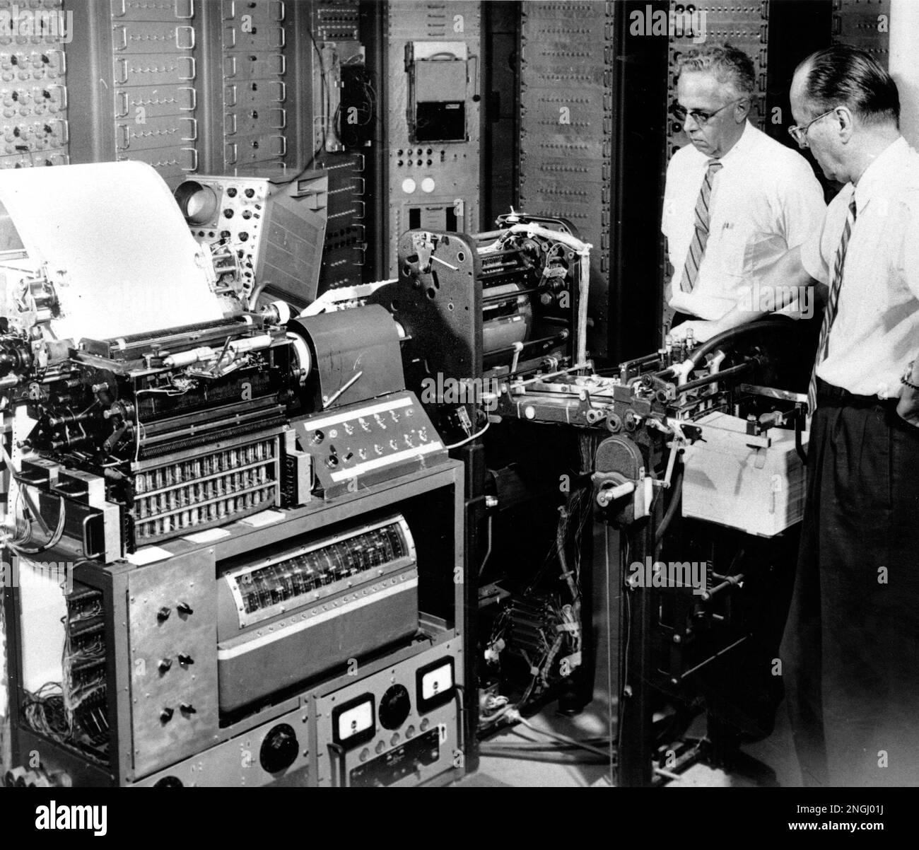 E.F. Lindquist, right, and Ted McCarrel operate a computer employed by ...