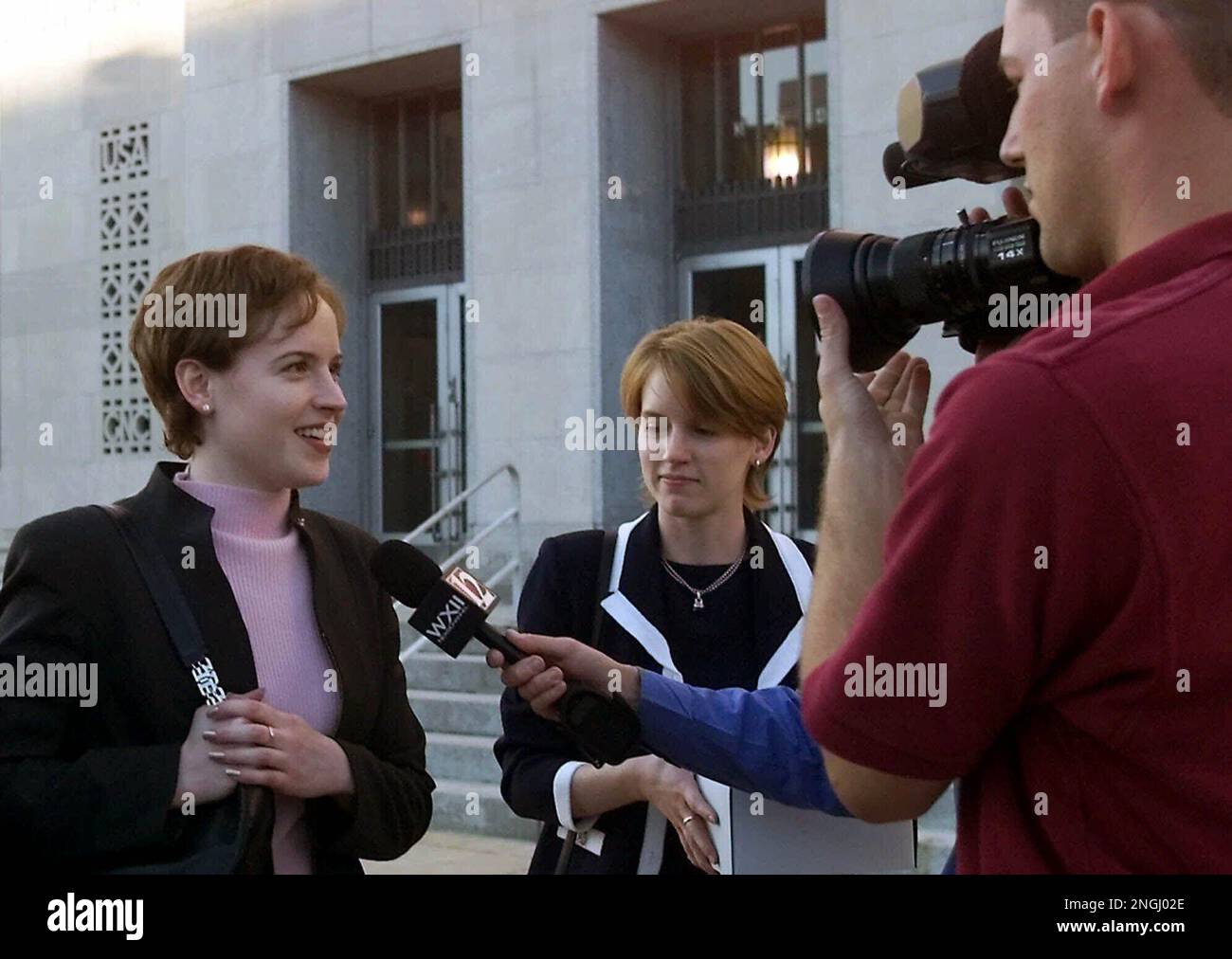 Heather Sue Mercer, left, answers reporters' questions as she leaves ...