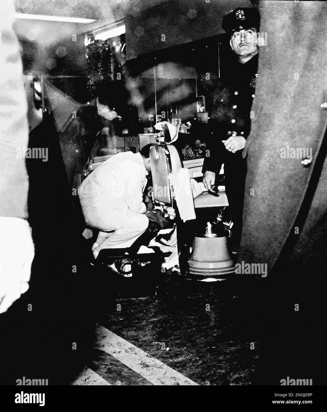 Warning: Graphic Content. A doctor leans over the body of mob boss ...