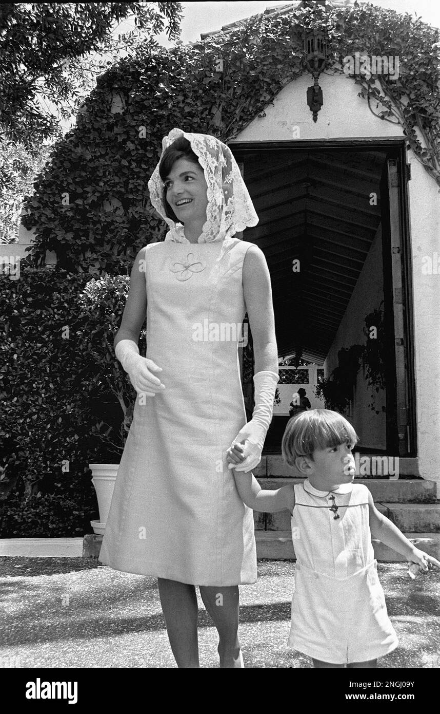 John F. Kennedy Jr. holds his mother's hand, U.S. First Lady Jacqueline ...