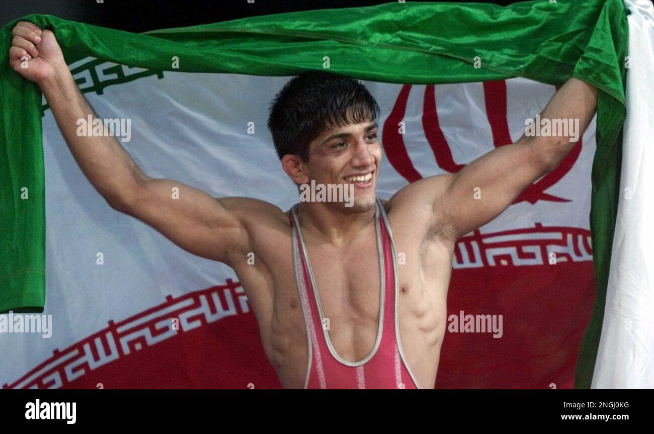 Iran's wrestler Alireza Dabir celebrates after defeating Yevgen ...