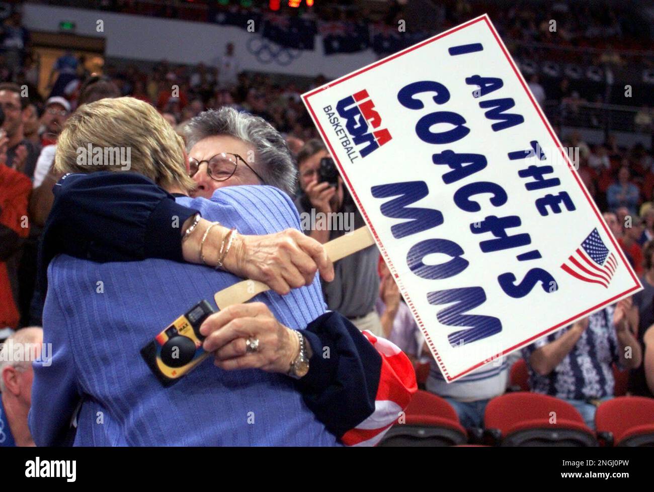 USA womens basketball coach Nell Ann Fortner, left, gets a hug from her ...