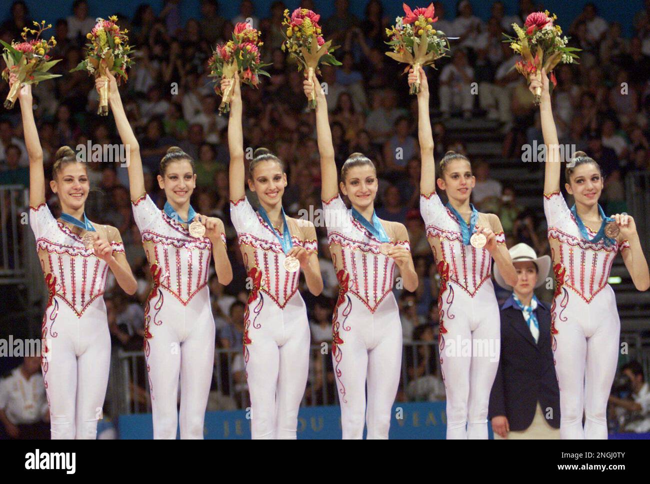 Bronze medalists from Greece hold up their medals following the group ...