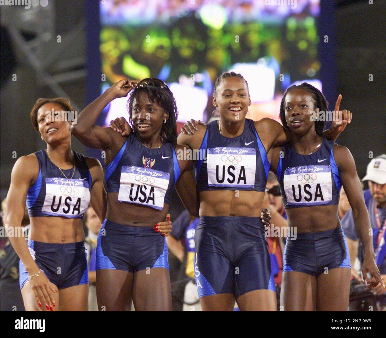 The U.S. 4x400-meter relay team celebrates after winning the gold medal ...