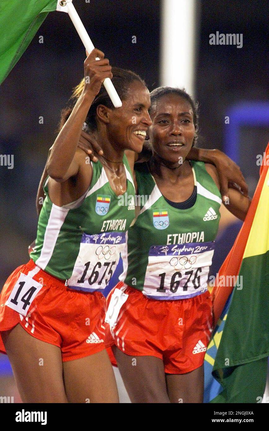 Ethiopian runners Deartu Tulu, left, and Gete Wami, right, celebrate ...