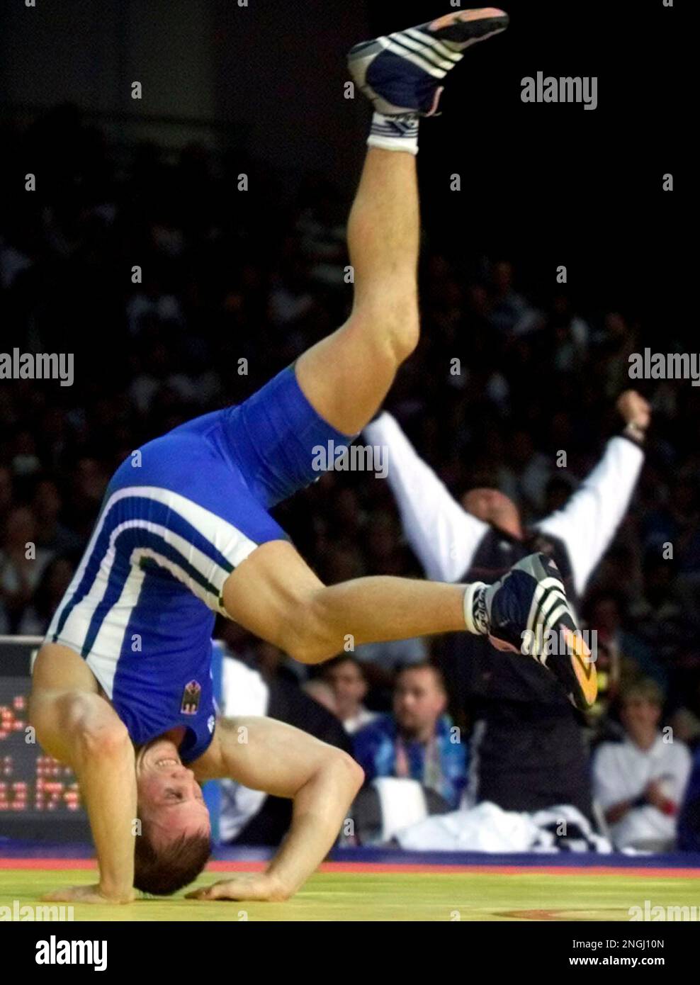 Alexander Leipold, from Germany, turns a cart-wheel after defeating USA ...