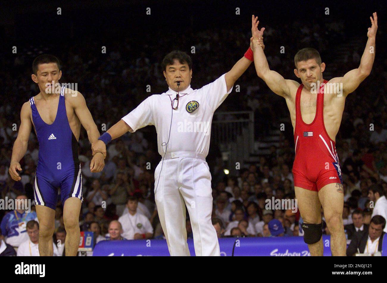 USA's Samuel Henson has his hand raised after defeating Belarus' German ...
