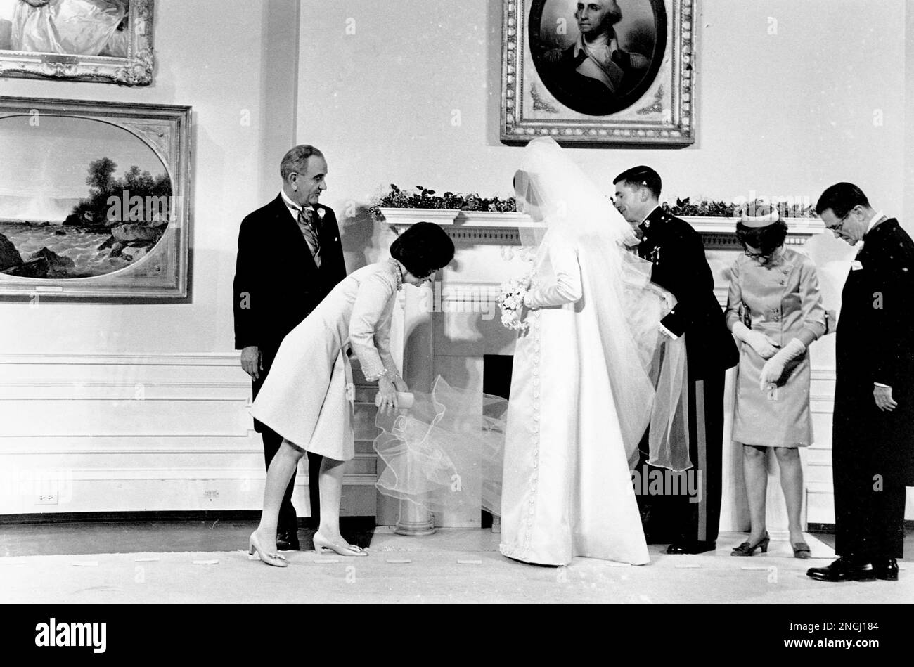 First lady and mother of the bride Lady Bird Johnson fixes the wedding ...
