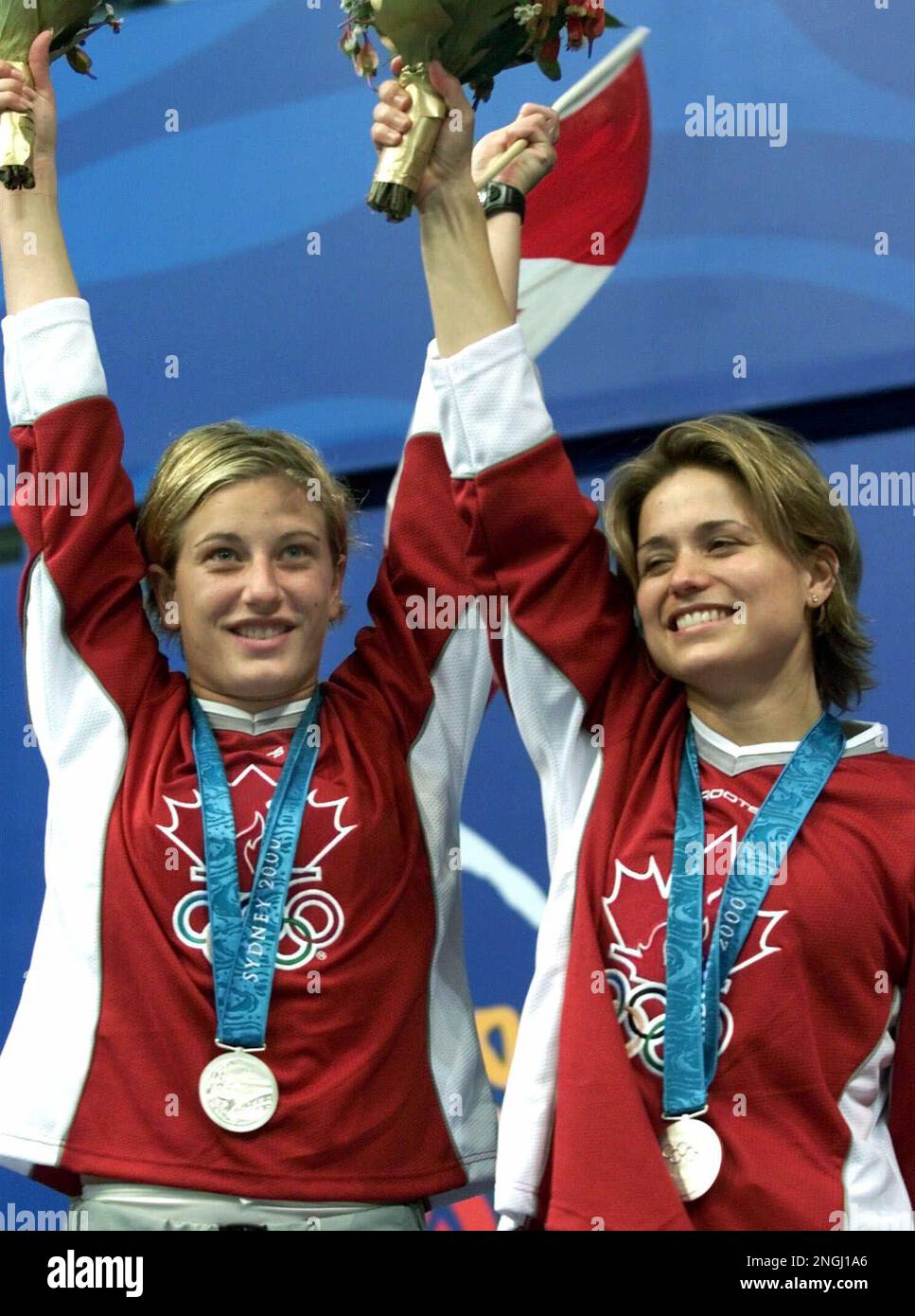 Canada's Emilie Heyman's, left, and Anne Montminy wave to the fans ...
