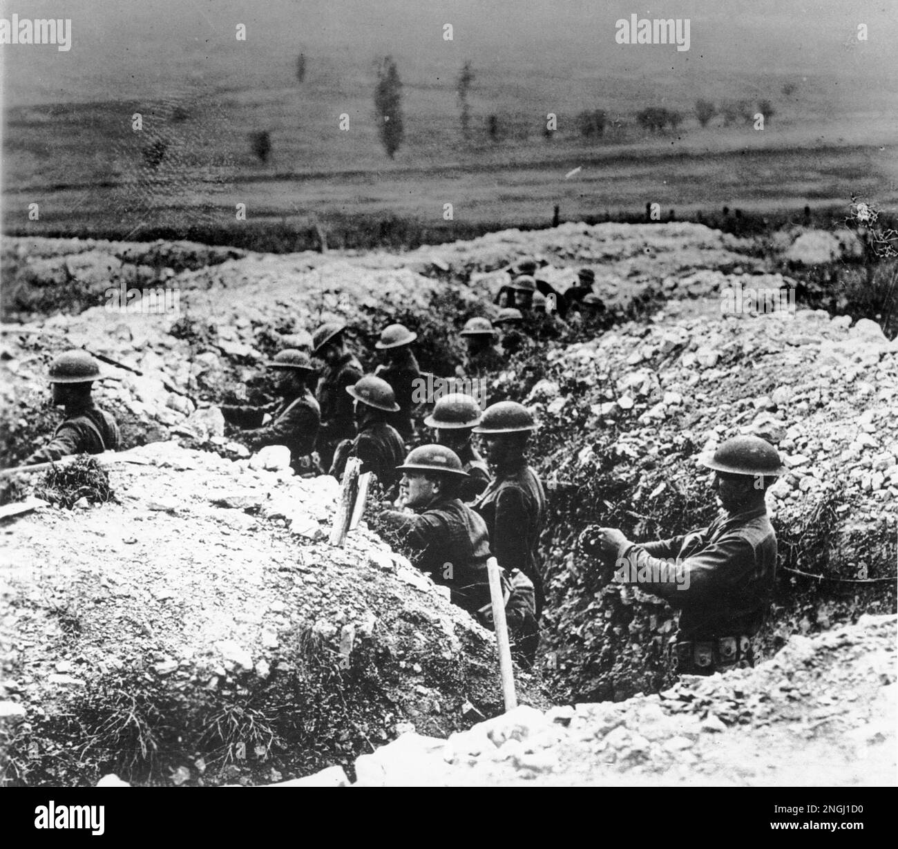 U.S. troops stand in trenches during World War I in France in 1918. (AP ...