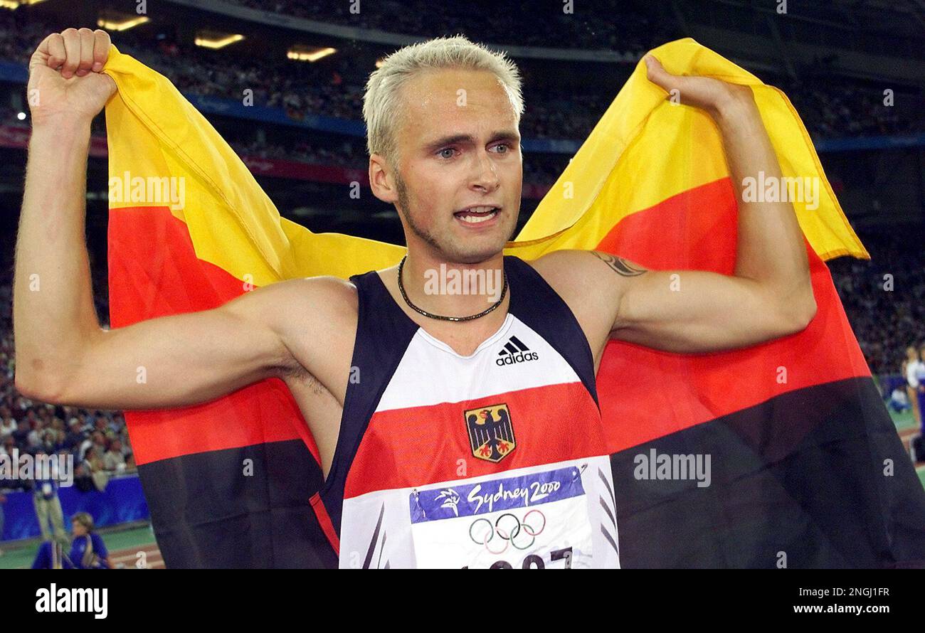 German sprinter Nils Schumann celebrates winning the gold medal in the ...