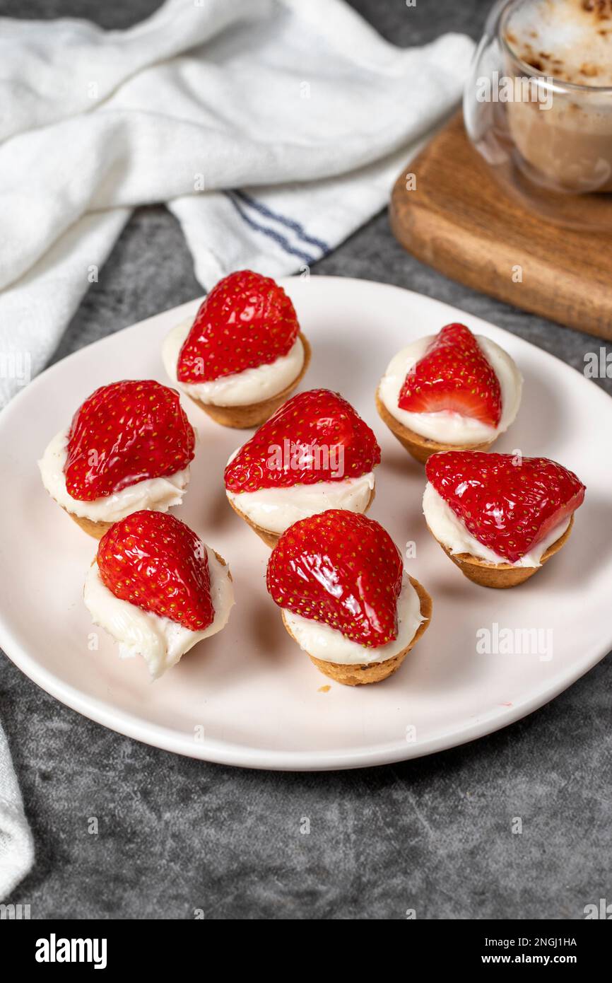Strawberry tartlet. Delicious tartlet dessert on plate. close up Stock ...