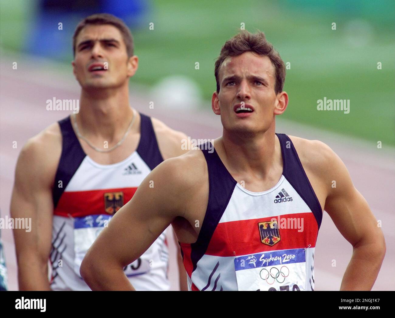 Germany's Mike Maczey, right, and Stefan Schmid look up at their times ...