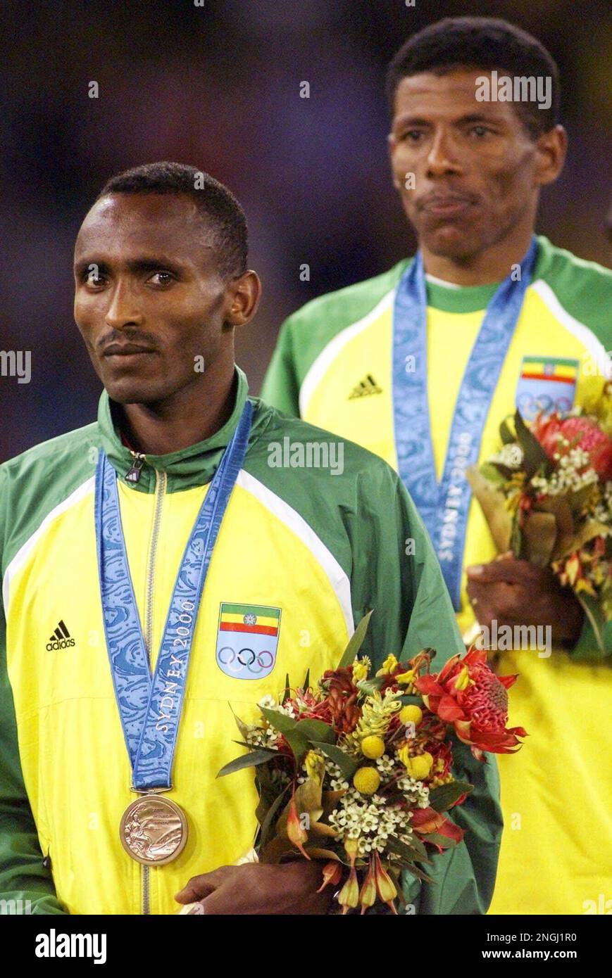 Ethiopia's Assefa Mezgebu, lower left, bronze medal winner in the men's ...