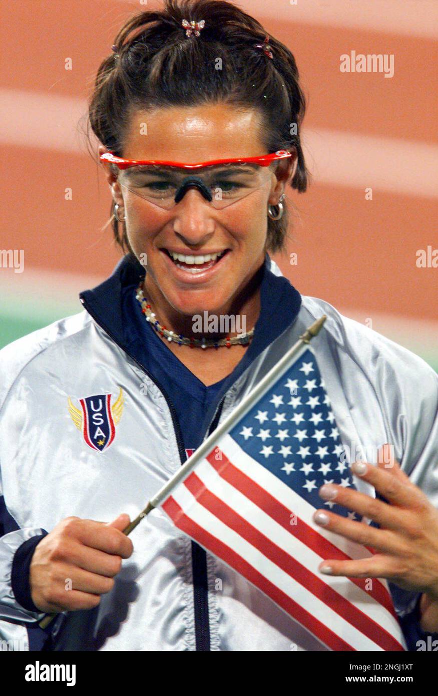 Stacy Dragila celebrates after winning the gold medal in the pole vault ...