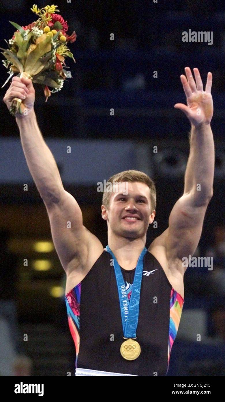 Alexei Nemov of Russia waves after receiving his gold medal for the ...