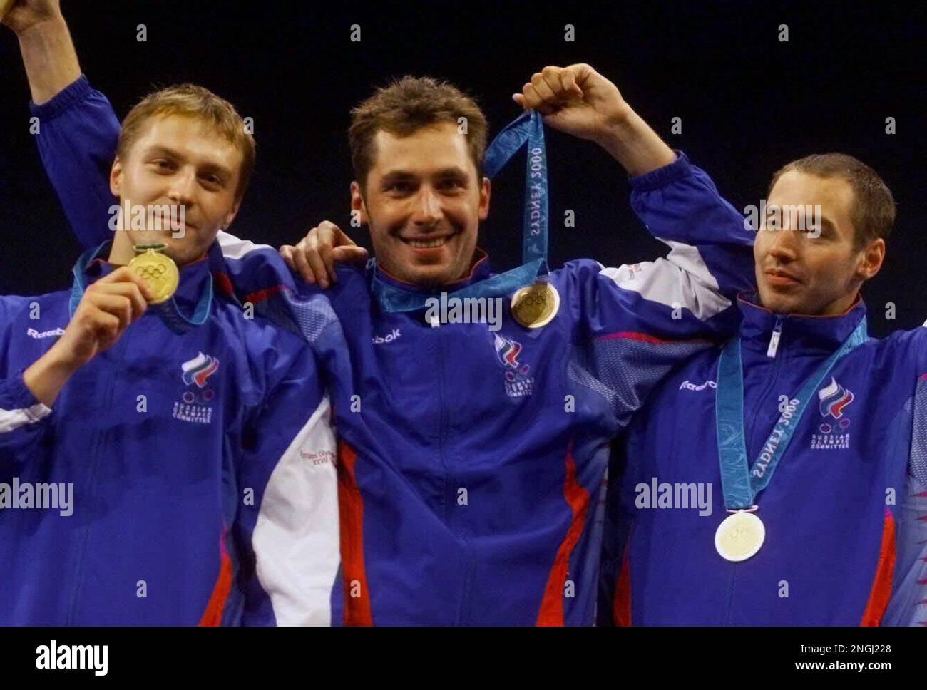 Fencers from the Russia's men's sabre team, from left Alexei Frossine ...