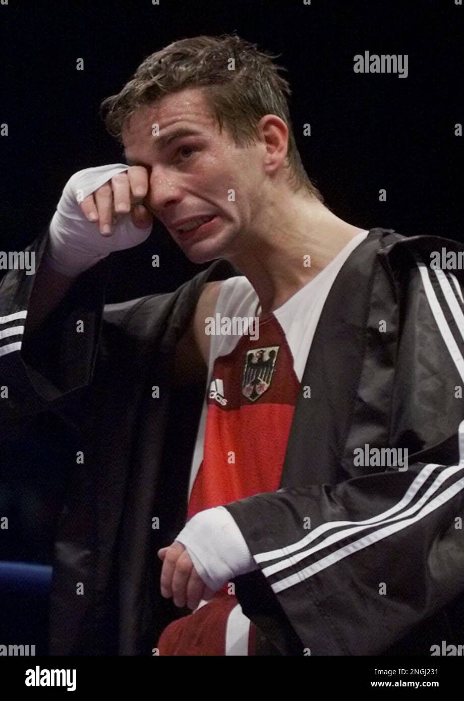 Germany's Kay Huste cries after losing to Italy's Sven Paris during a ...
