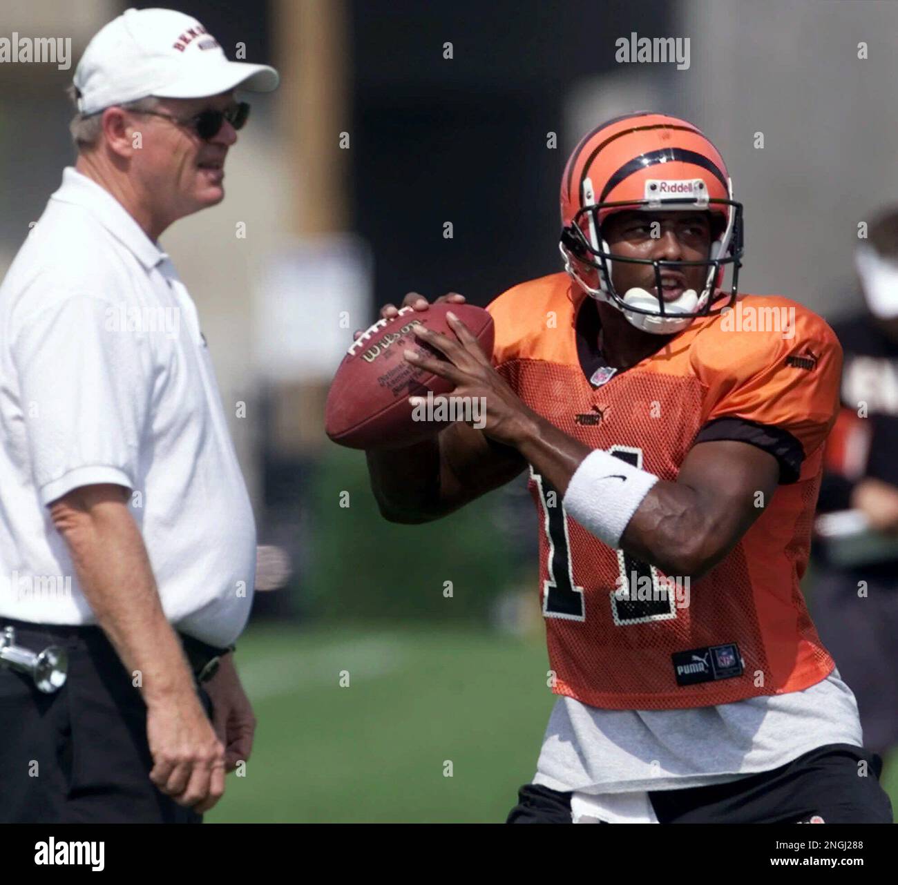 Cincinnati Bengals quarterback Akili Smith (11) sets to throw a pass as ...