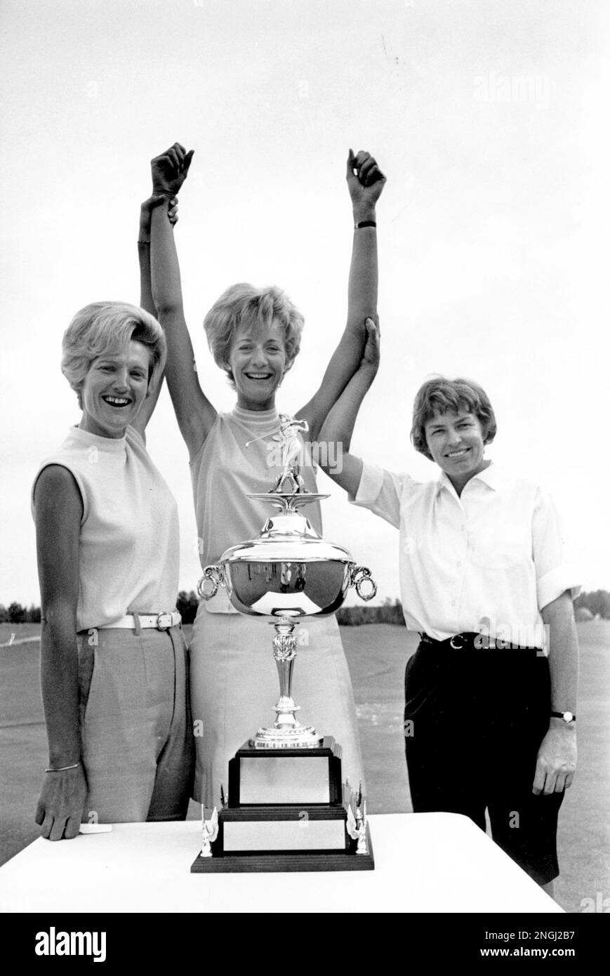 Carol Mann, of Baltimore, holds up her arms in a victory sign after ...