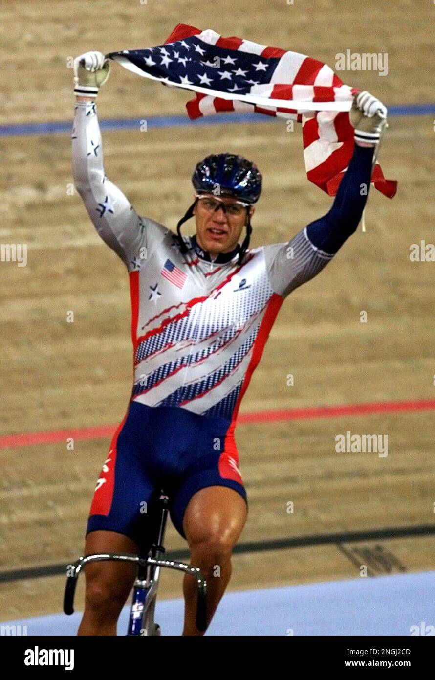 U.S.A's Marty Nothstein waves the U.S. flag after wining the gold medal ...