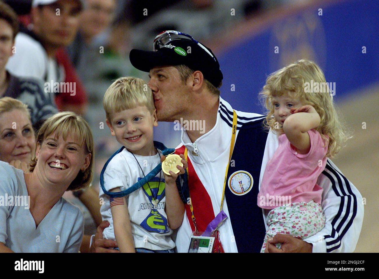 USA's Marty Nothstein kisses his son, Tyler, after receiving his gold ...