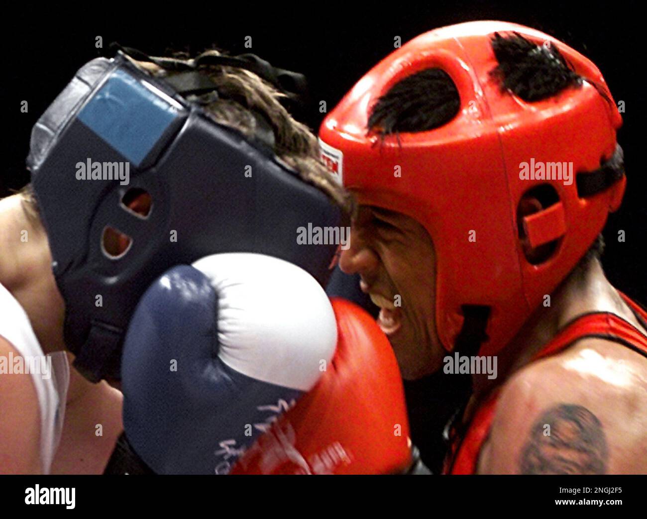 Germany's Kay Huste, in blue, covers his face as he gets pounded by ...