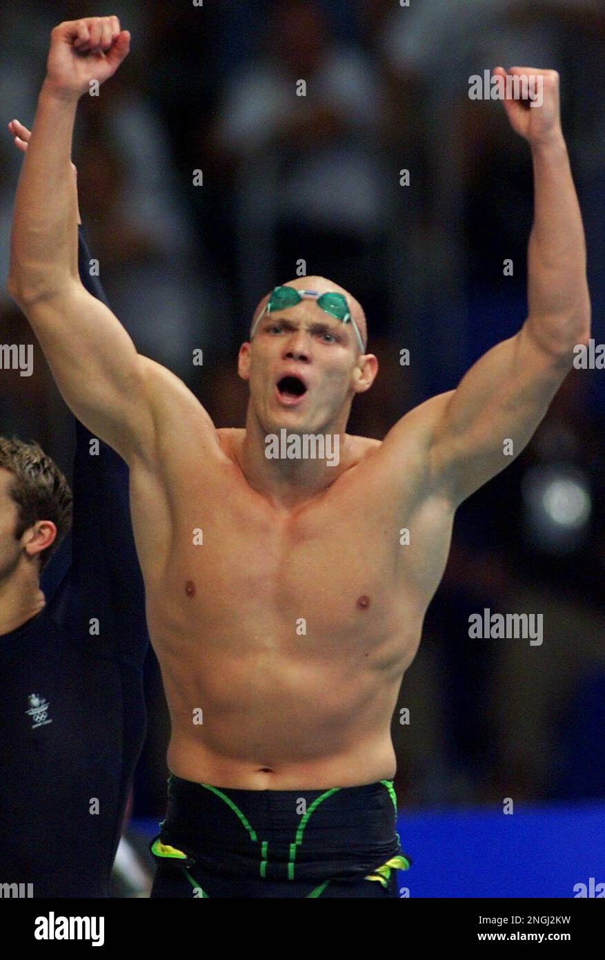 Australian swimmer Michael Klim celebrates his team's gold medal in the ...