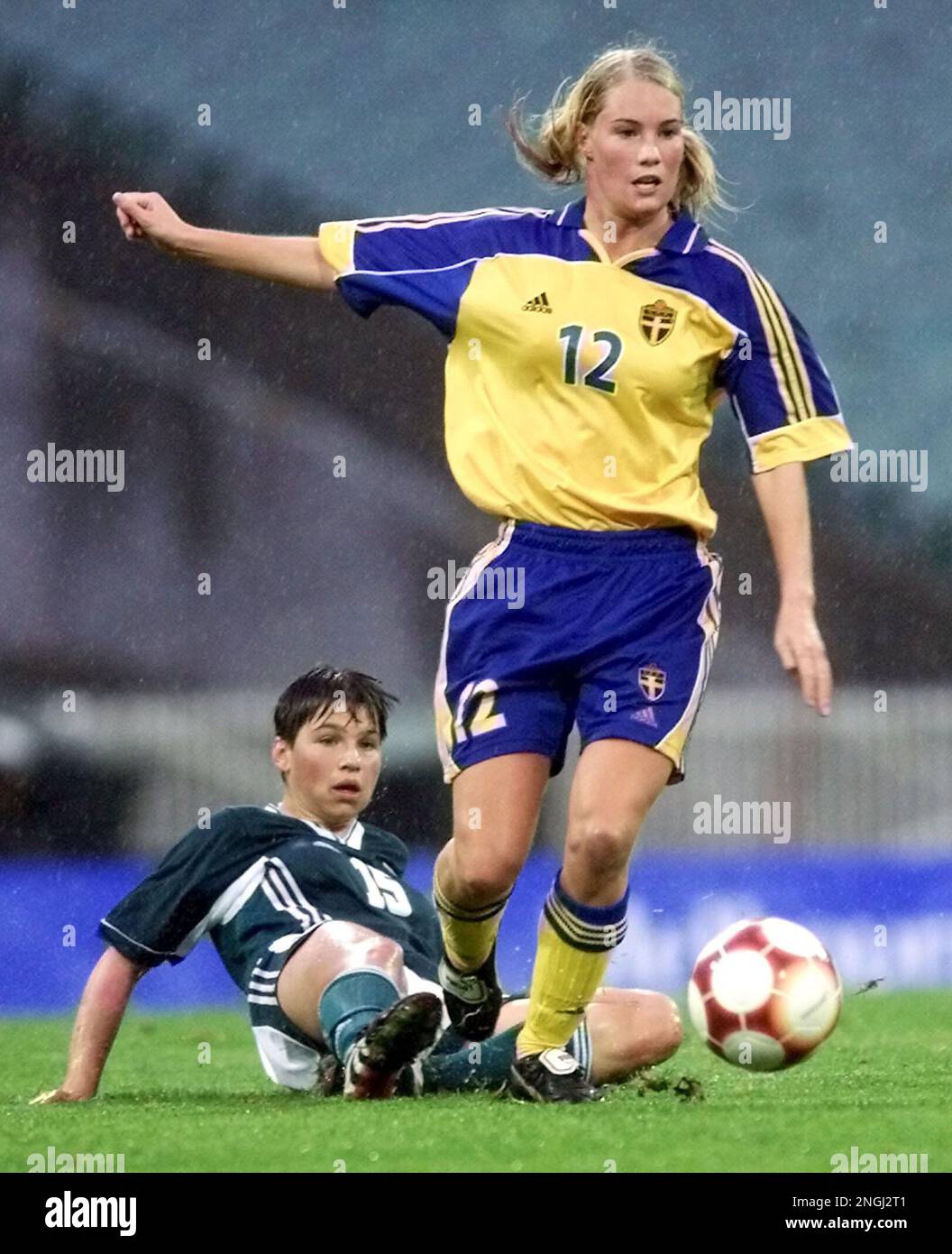 Sweden's Hanna Marklund (12) gets by German defender Ariane Hingst (15 ...