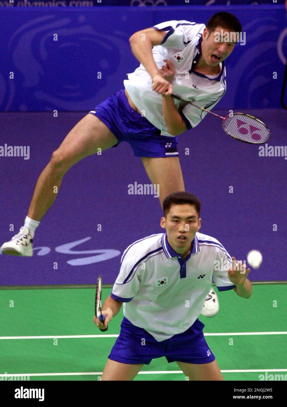 Korea's Ha Tae-Kwon returns a shot over partner Kim Dong-Moon during a ...