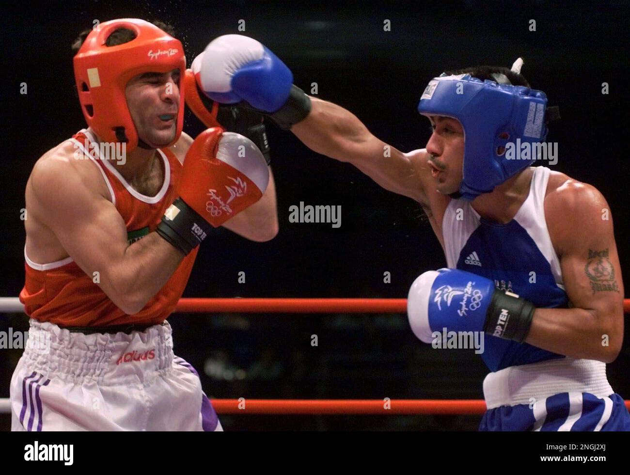Ricardo Juarez, right, of the United States, swings a right to Iran's ...