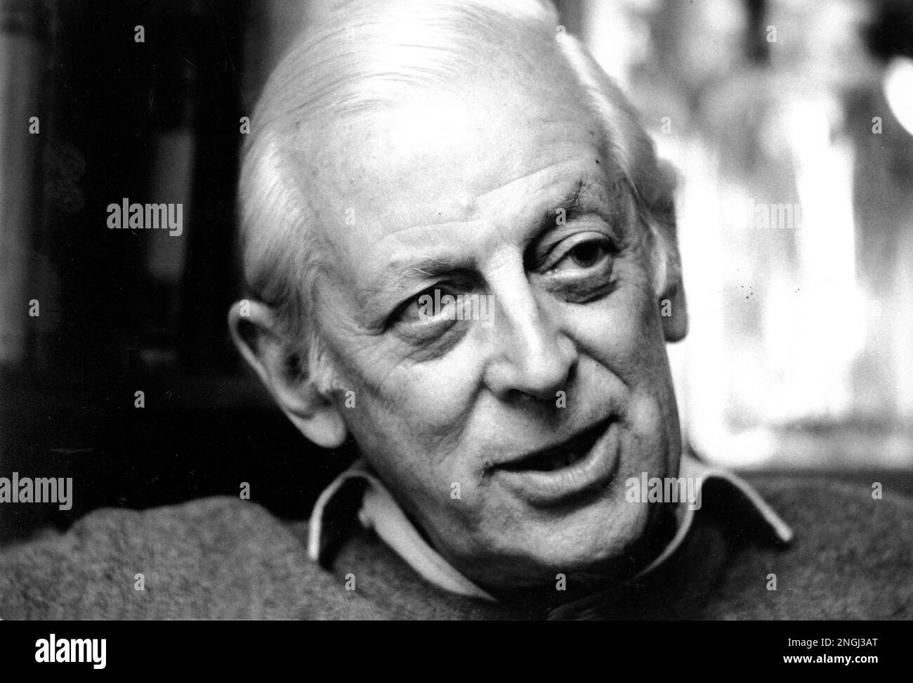 Journalist Alistair Cooke poses in his home in New York City on Oct. 12 ...