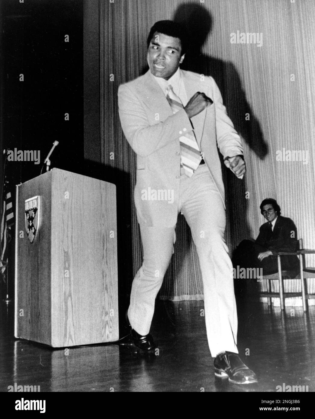 World champion boxer Muhammad Ali throws a punch and does a shuffle ...