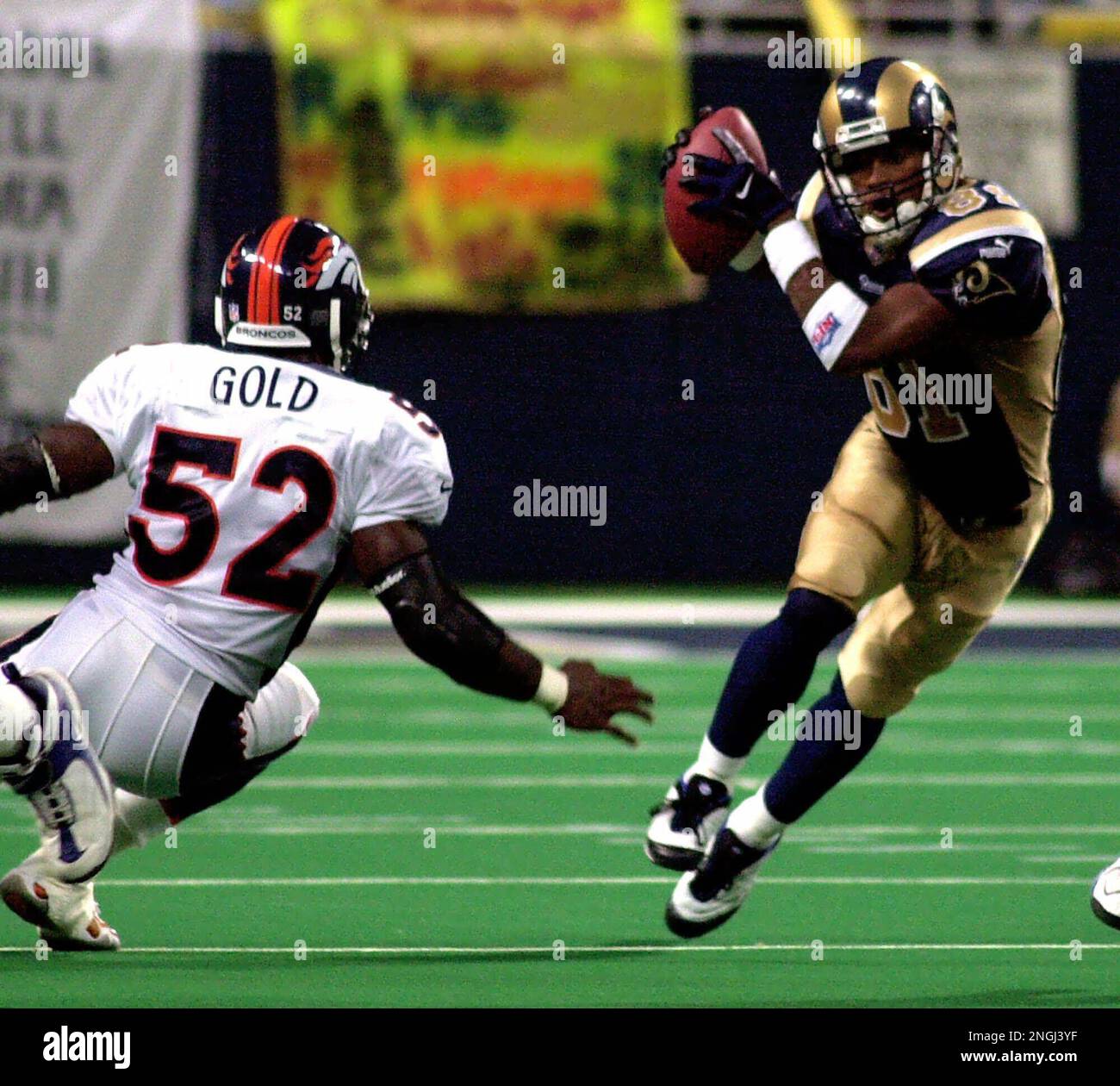 St. Louis Rams Az-Zahir Hakim carries the ball as Denver Broncos Ian ...