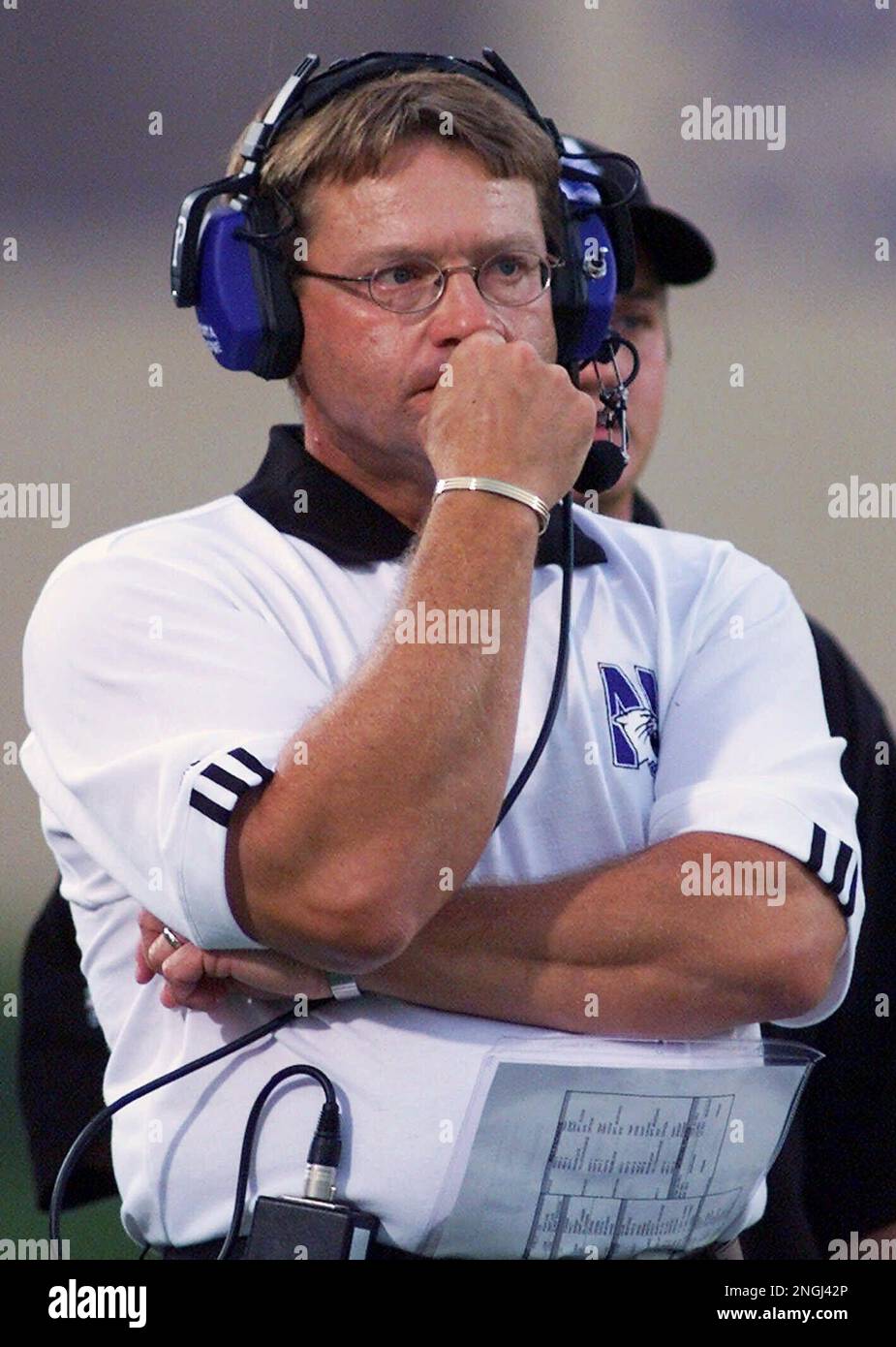Northwestern head coach Randy Walker studies his team in action against ...