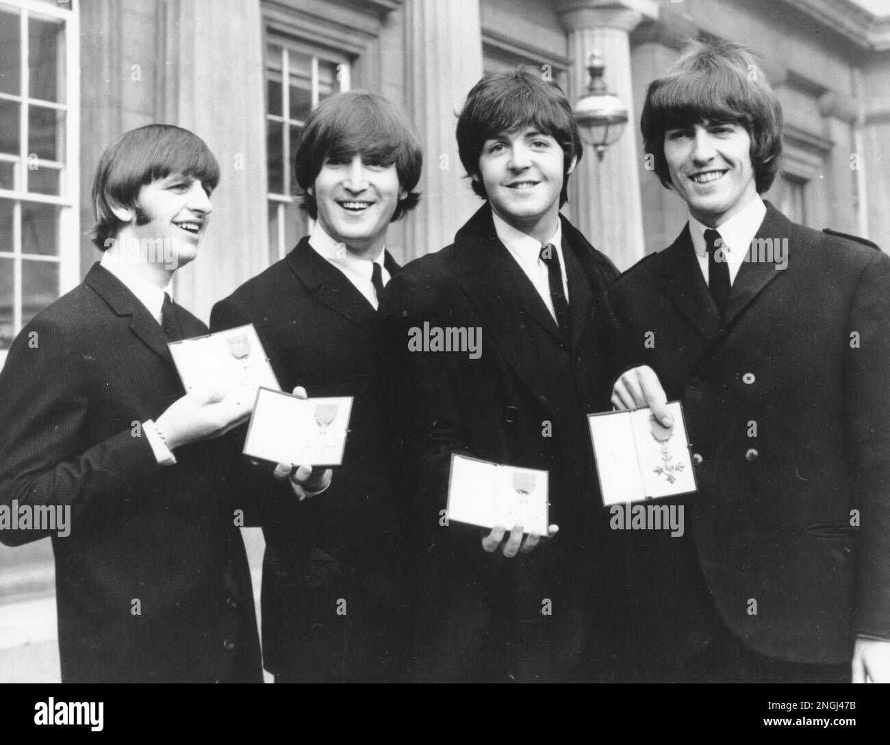The Beatles smile as they display the Member of The Order of The ...