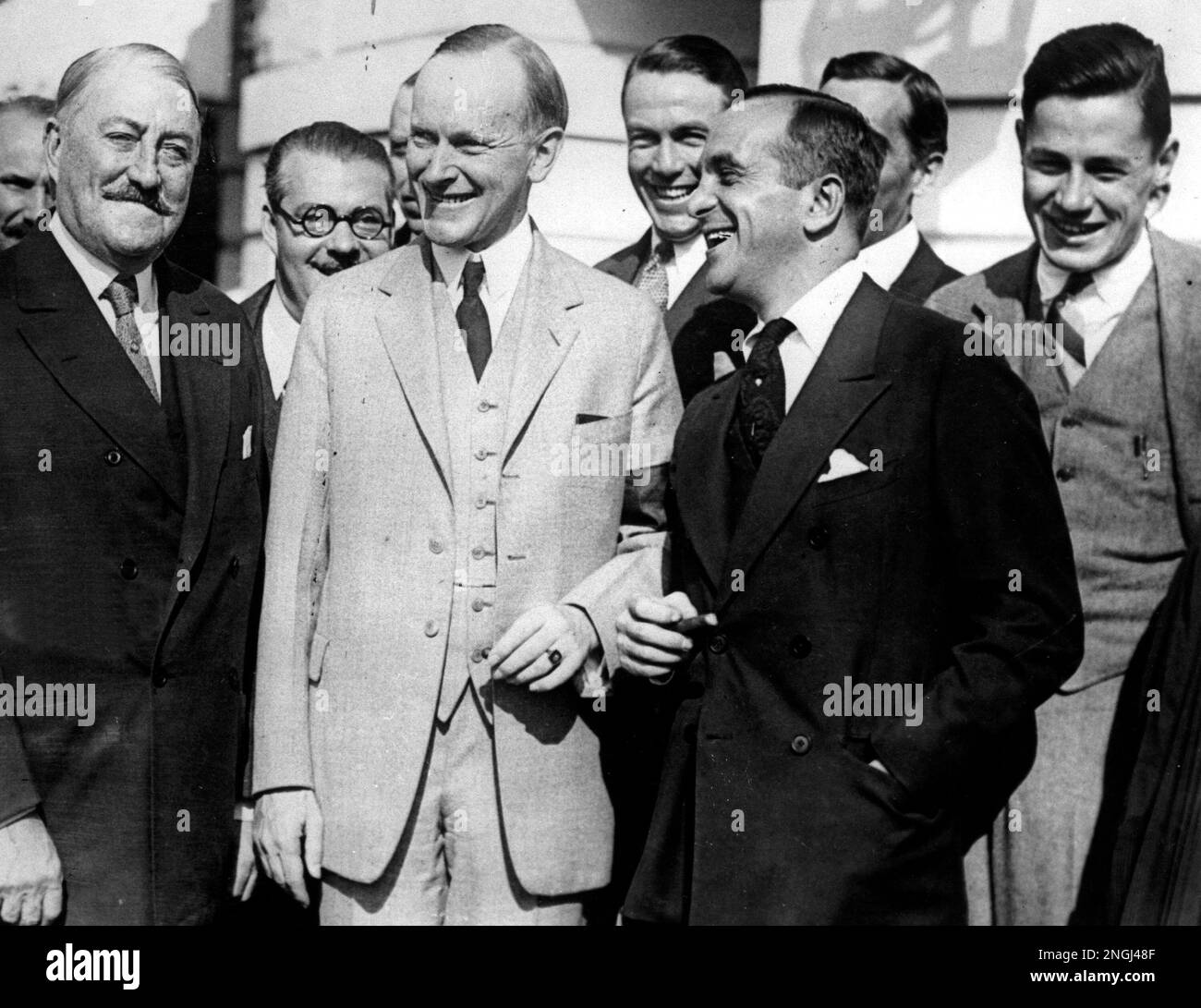 U.S. President Calvin Coolidge poses between actor John Drew, left, and ...