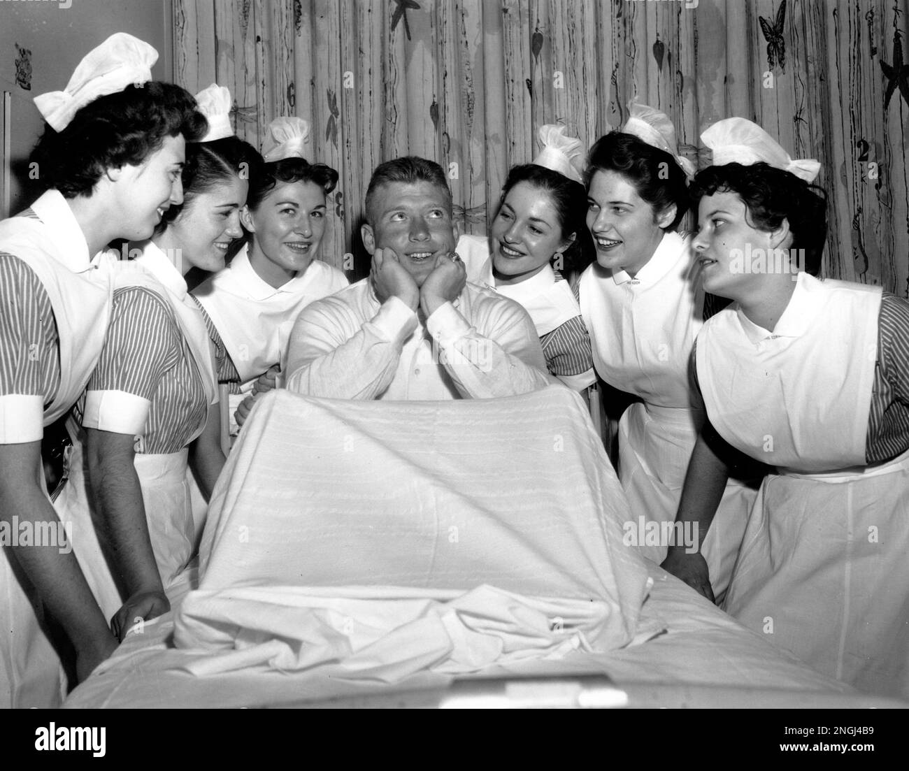 Yankee center fielder Mickey Mantle is the center of attraction before ...