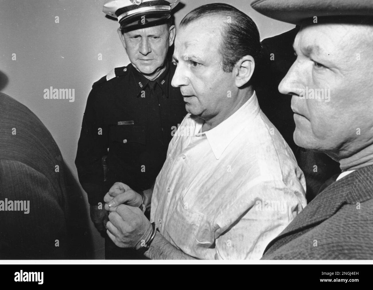 Nightclub owner Jack Ruby is led through the Dallas city jail on his ...