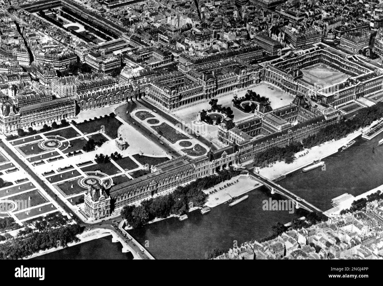 This aerial view shows the Palace of the Louvre along the right bank of ...