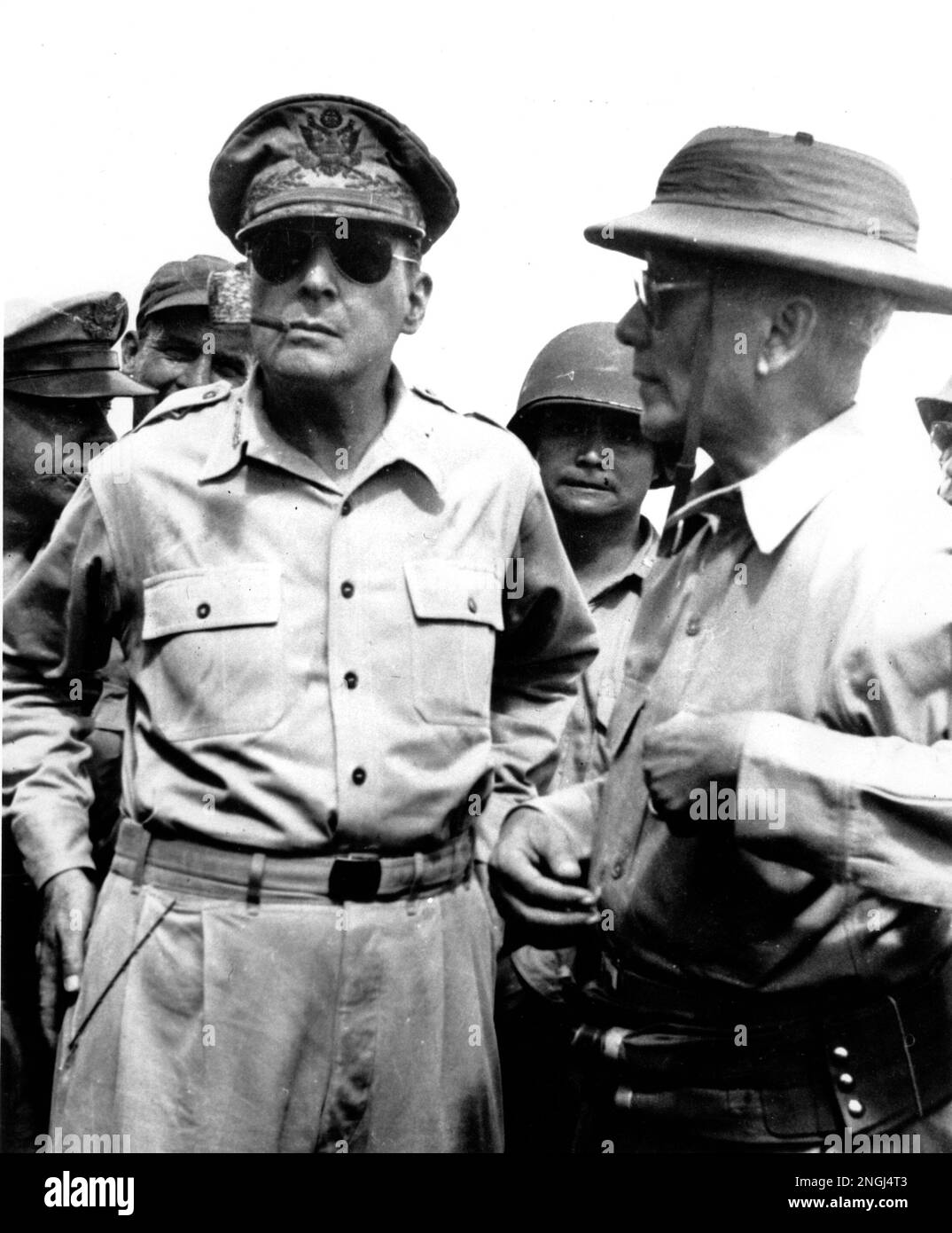 Gen. Douglas MacArthur, left, confers with Sergio Osmena, president of ...