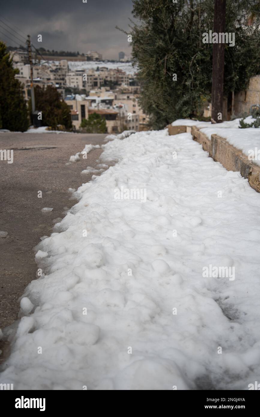 Amman, Jordan - 09 February 2023 snow build up on the side of the roads ...