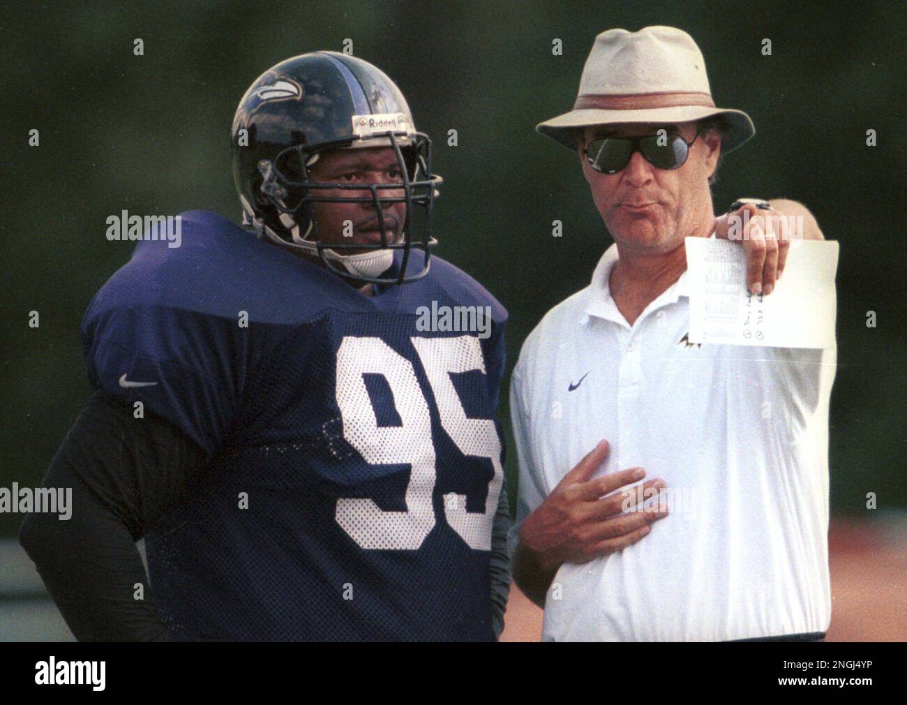 Baltimore Ravens head coach Brian Billick, right, has a private word ...