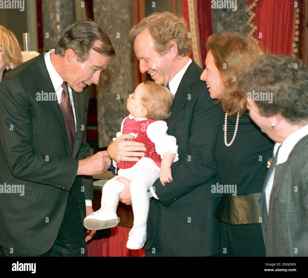 President-elect George Bush, left, takes a moment Jan. 3, 1988 to meet ...