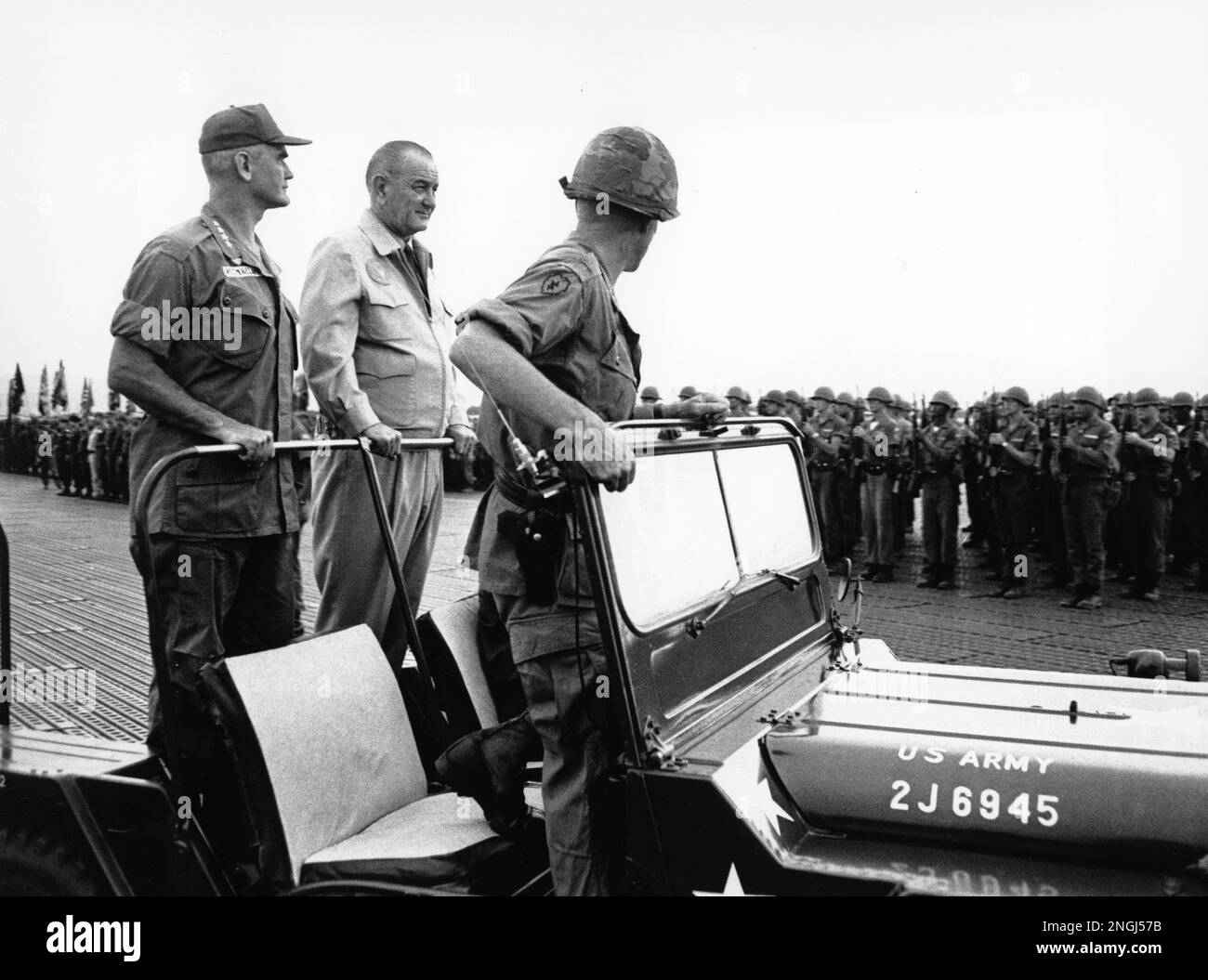 U.S. President Lydon B. Johnson reviews troops assembled in honor of ...