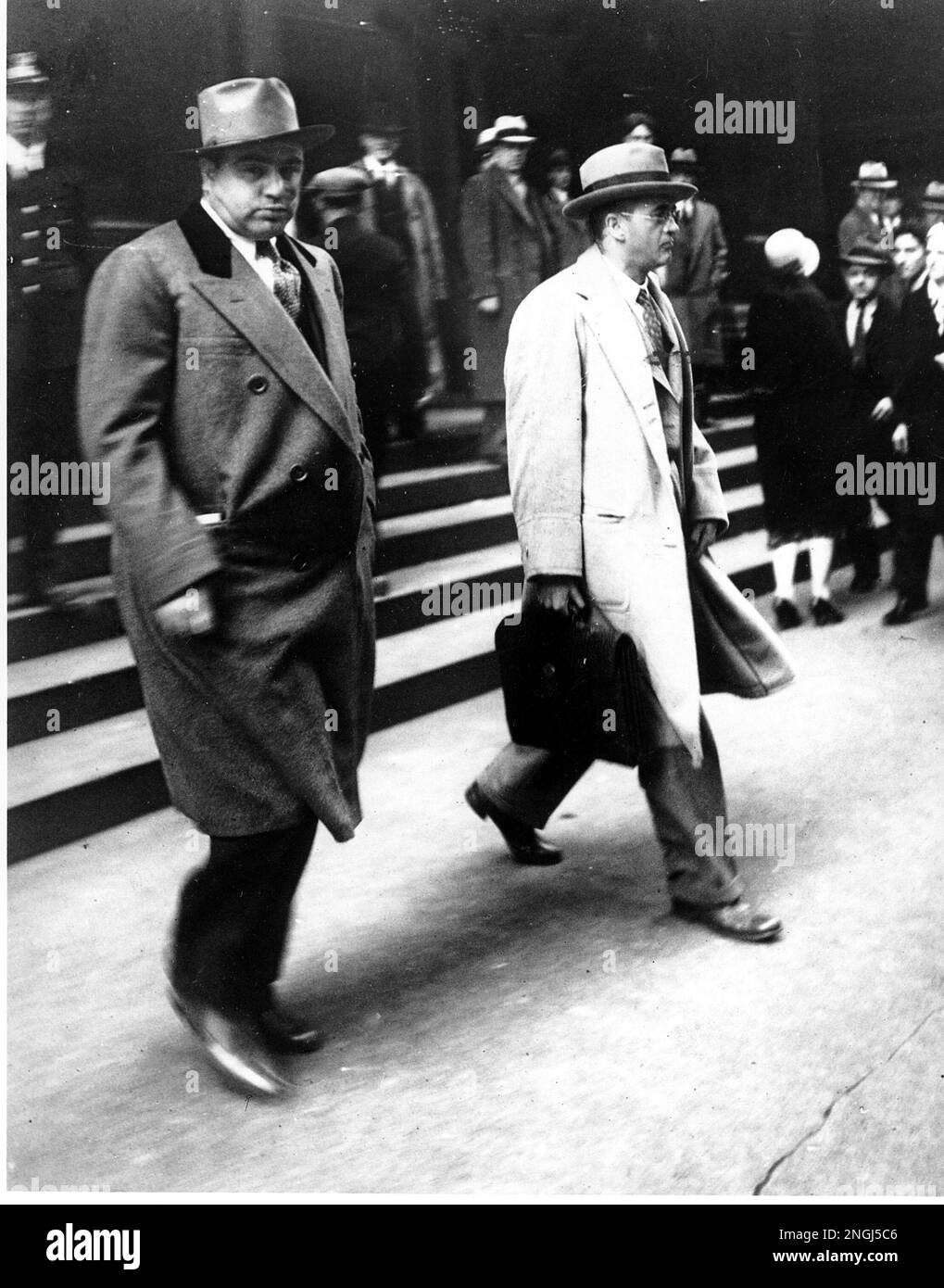 Al Capone looks at the camera as he walks out of Federal Court in ...