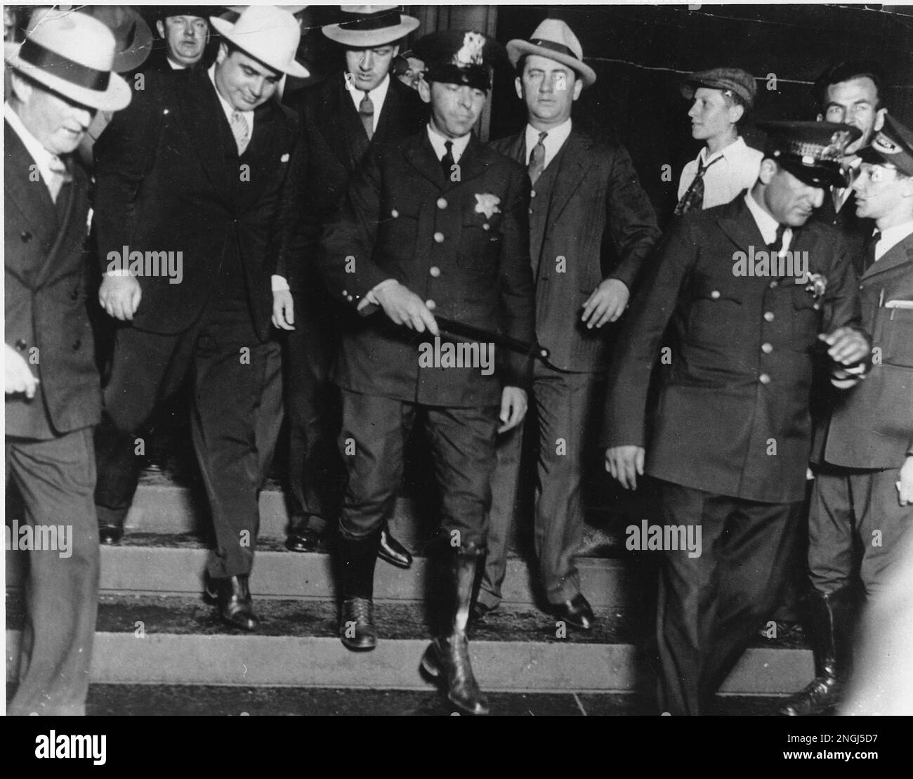 Chicago crime boss Al Capone, left, wearing white hat, is in the ...