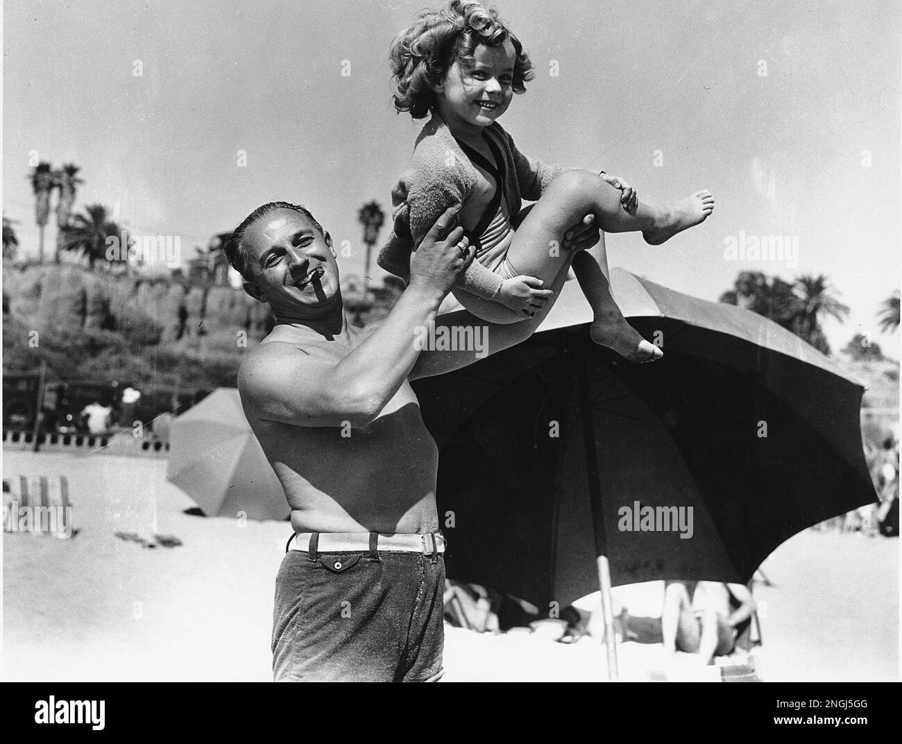 Shirley Temple, 5-year-old screen actress, is shown with her father ...