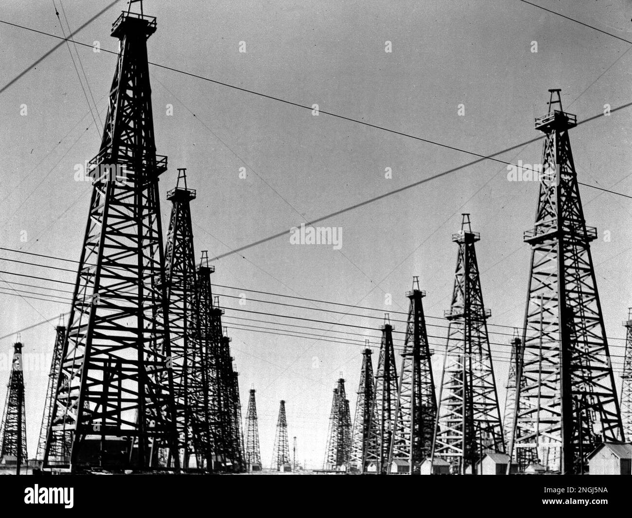This photo shows a street of oil derricks at Spindletop, three miles ...